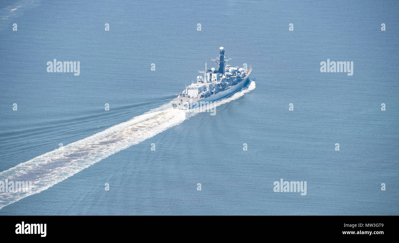 Aerial photo of Royal Navy Frigate on calm sea Stock Photo - Alamy