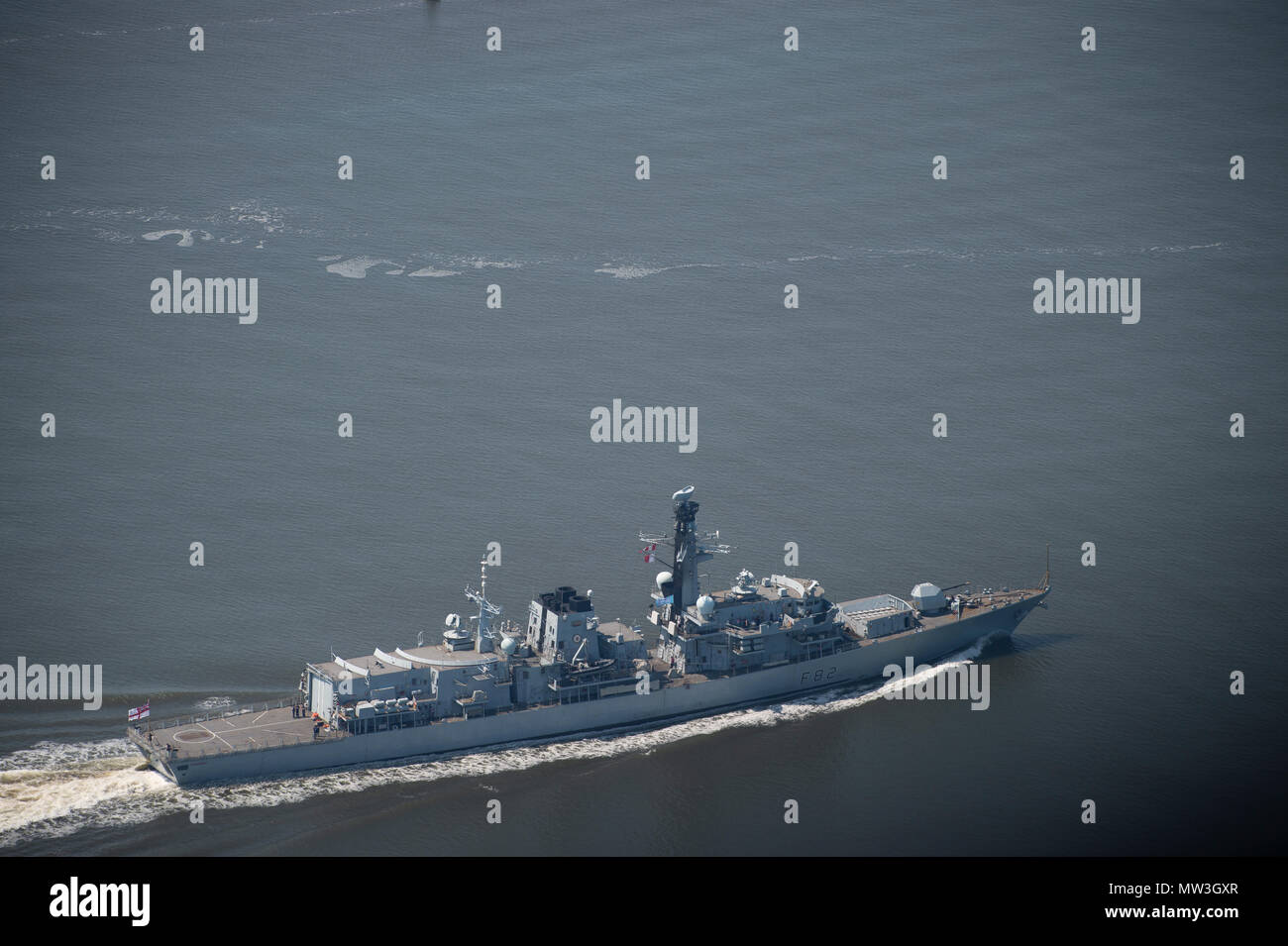 Aerial photo of Royal Navy Frigate on calm sea Stock Photo - Alamy