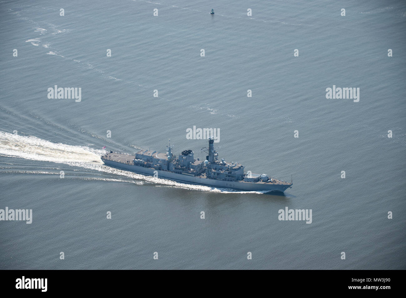 Aerial photo of Royal Navy Frigate on calm sea Stock Photo - Alamy