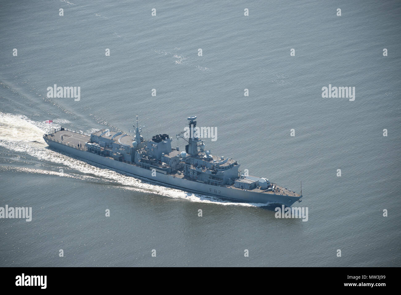 Aerial photo of Royal Navy Frigate on calm sea Stock Photo - Alamy