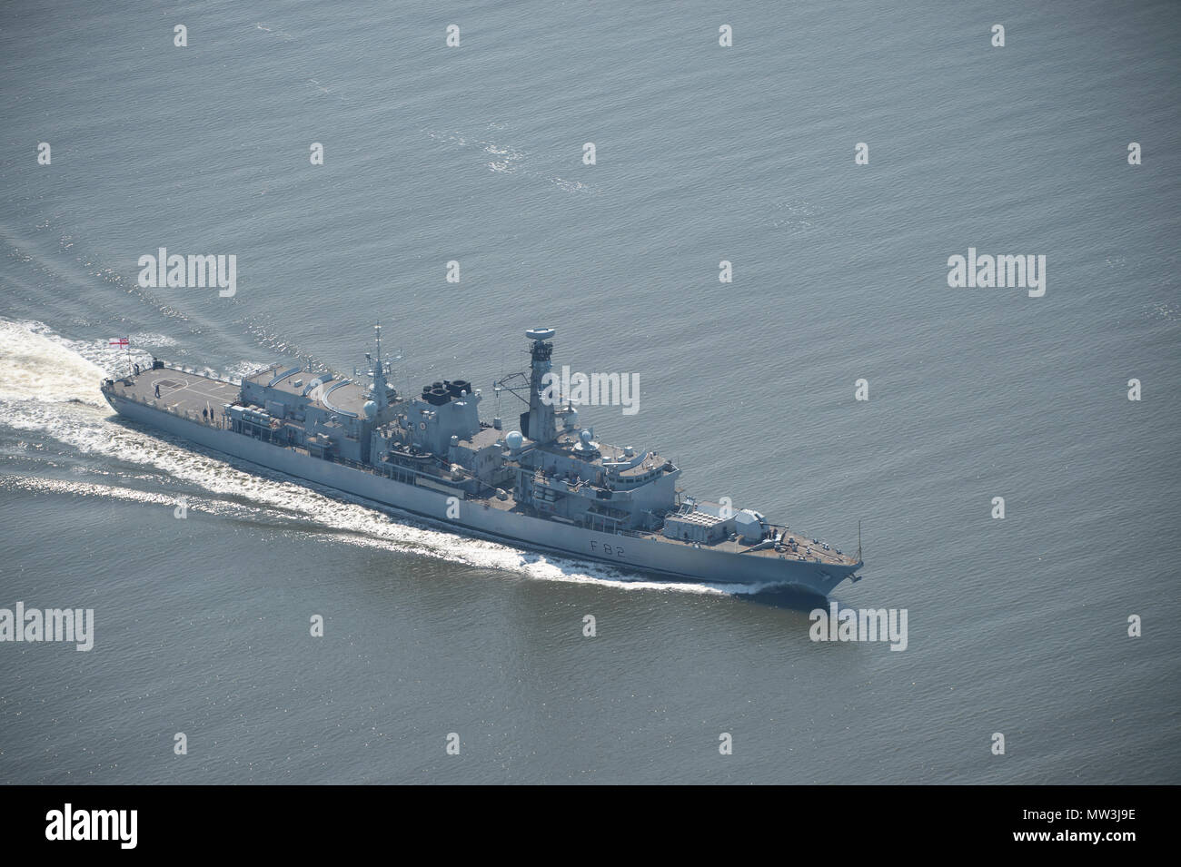 Aerial photo of Royal Navy Frigate on calm sea Stock Photo - Alamy
