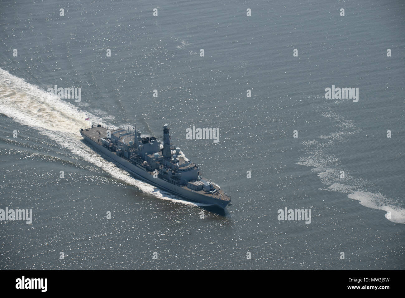Aerial photo of Royal Navy Frigate on calm sea Stock Photo - Alamy