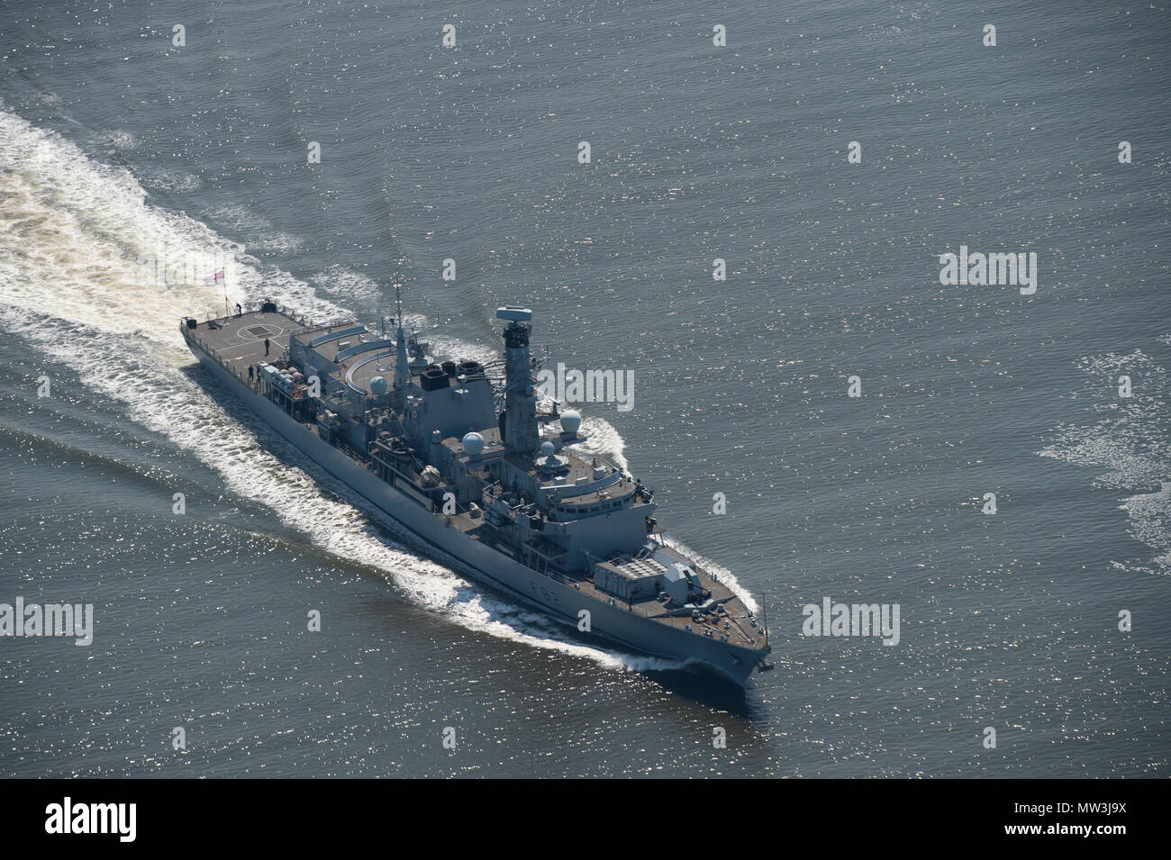 Aerial photo of Royal Navy Frigate on calm sea Stock Photo - Alamy