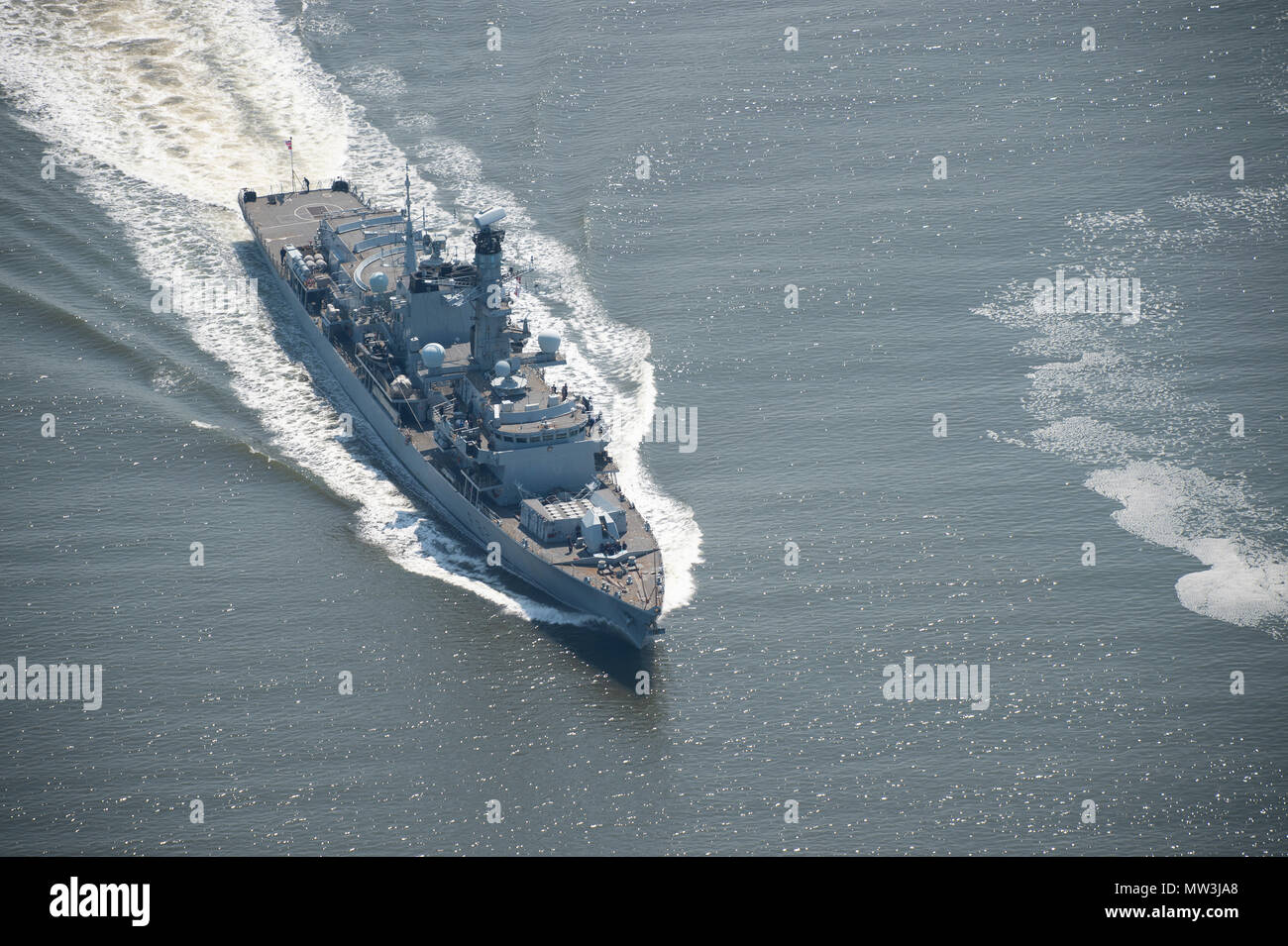 Aerial photo of Royal Navy Frigate on calm sea Stock Photo - Alamy