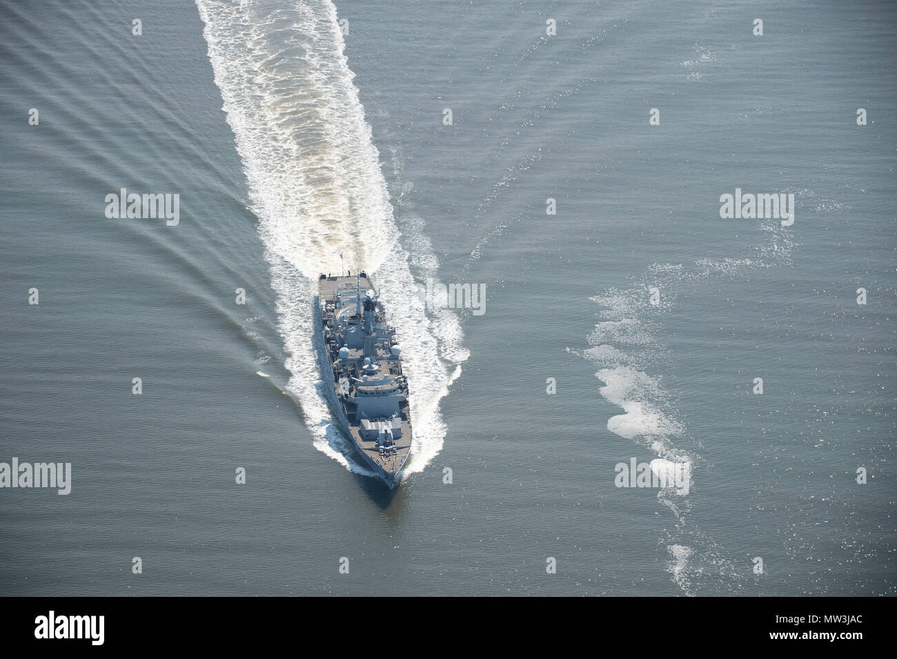 Aerial photo of Royal Navy Frigate on calm sea Stock Photo - Alamy