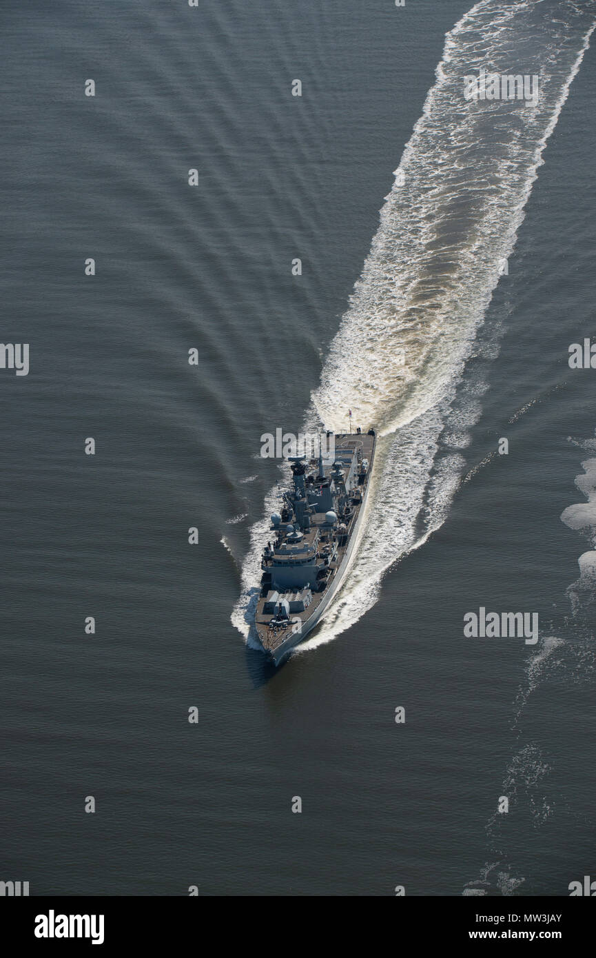 Aerial photo of Royal Navy Frigate on calm sea Stock Photo - Alamy
