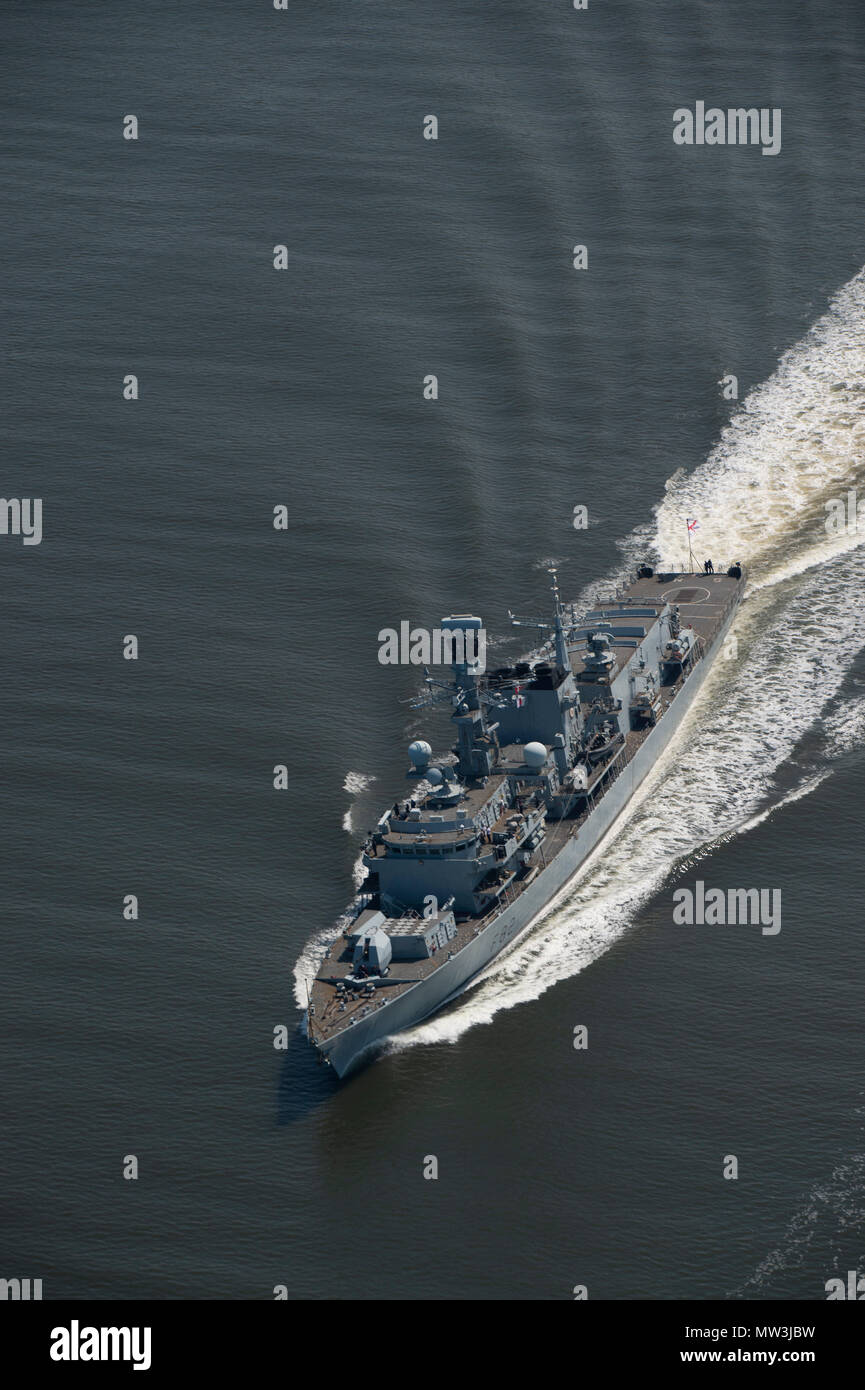 Aerial photo of Royal Navy Frigate on calm sea Stock Photo - Alamy