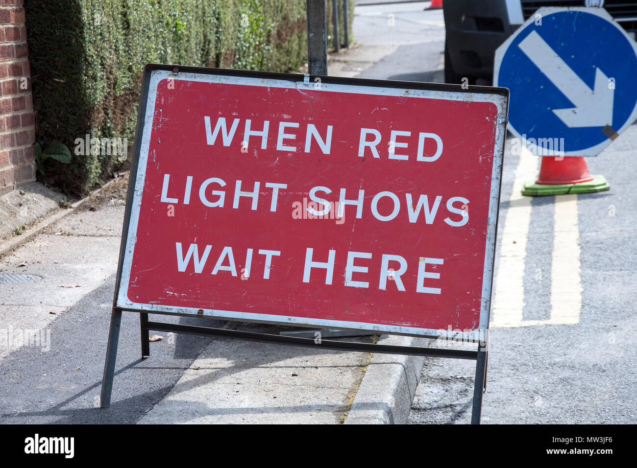 Road sign in UK. When red light shows wait here Stock Photo - Alamy