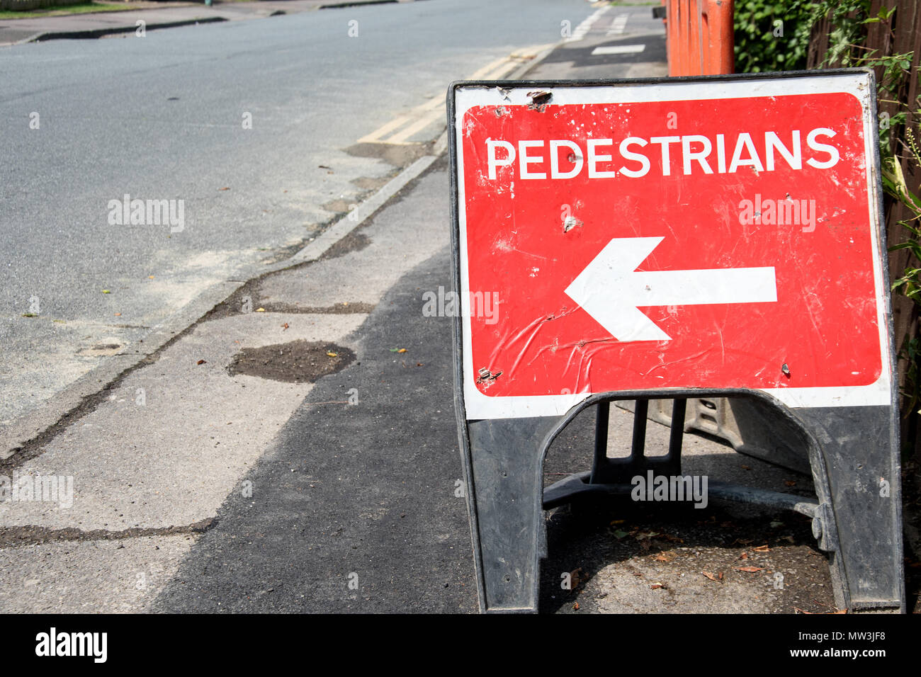 Road sign informing pedestrians to move to the left Stock Photo - Alamy