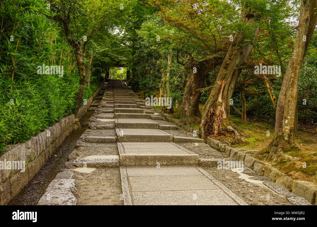 Stone path of ancient garden at old town in Kyoto, Japan Stock Photo ...