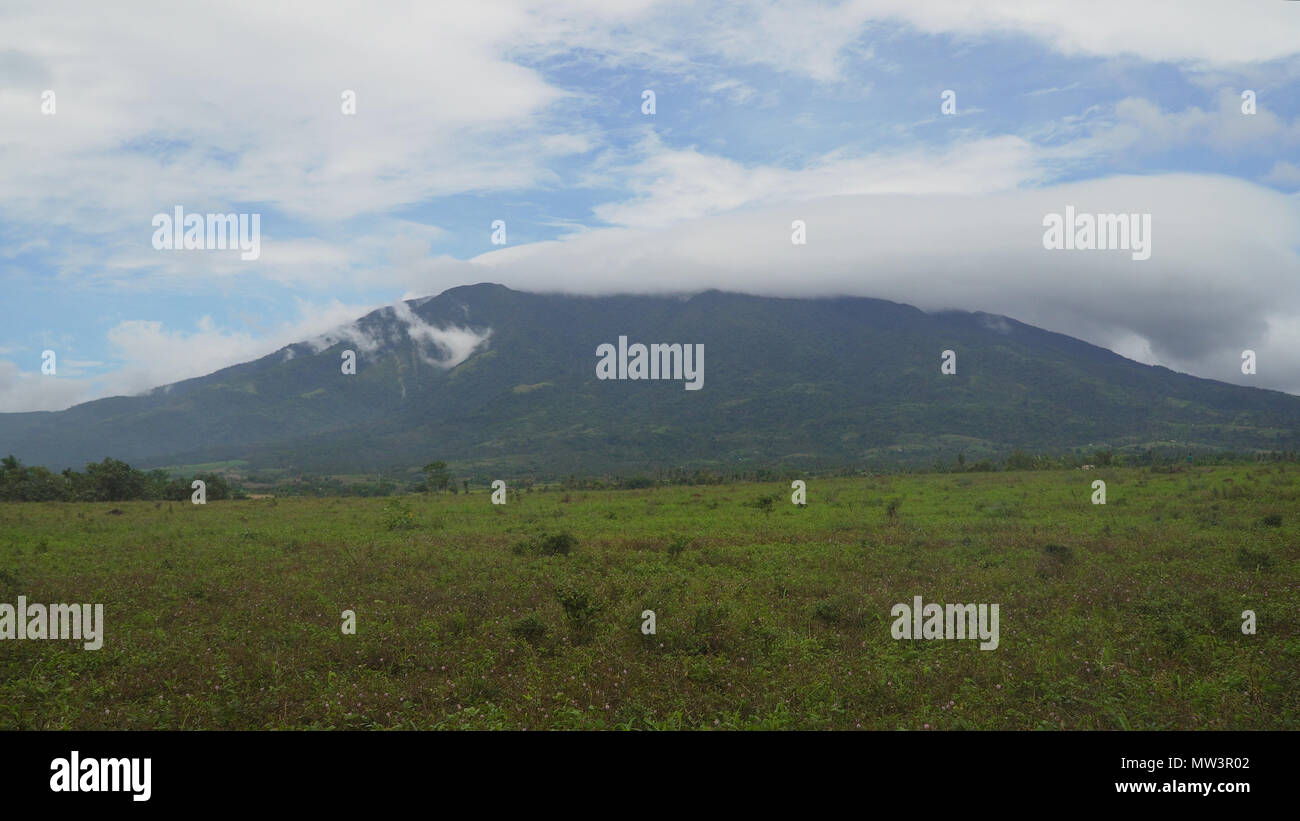 Mountain valley near mount Isarog. Mount with green tropical rainforest ...