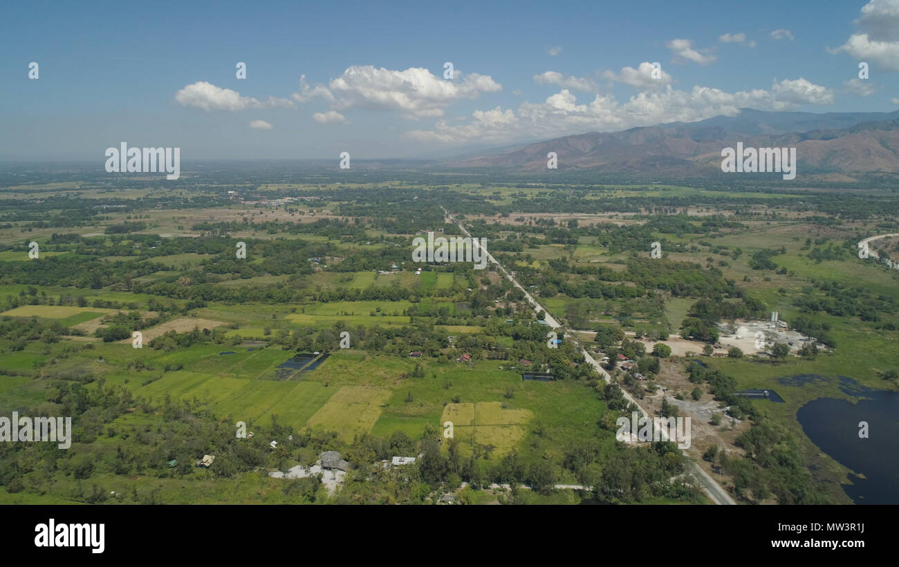 Mountain valley with village, river, farmland in the Philippines, Luzon ...
