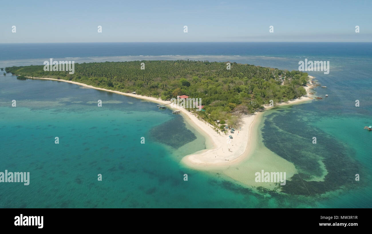 Tropical island with white sandy beach. Aerial view: Magalawa island ...