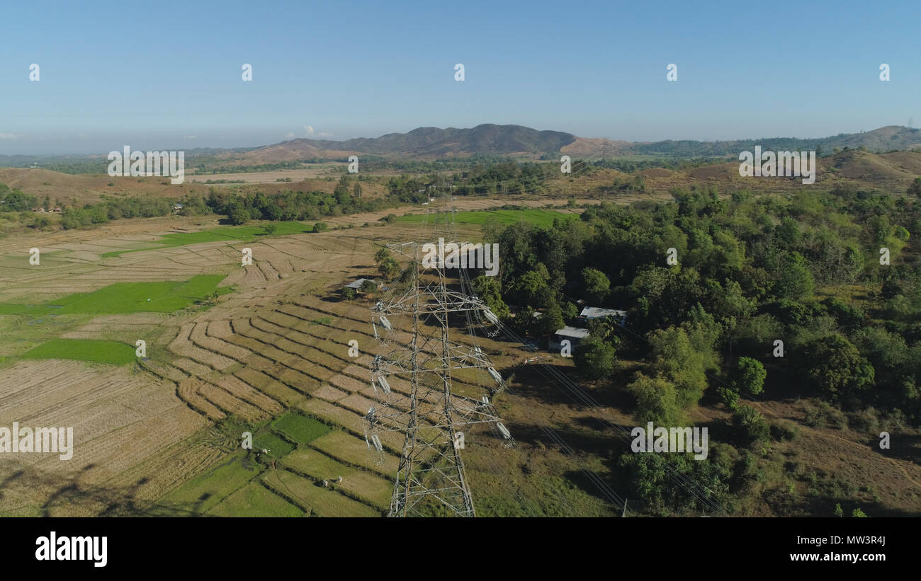 Power pylons and high voltage lines passing through mountain cordillera ...