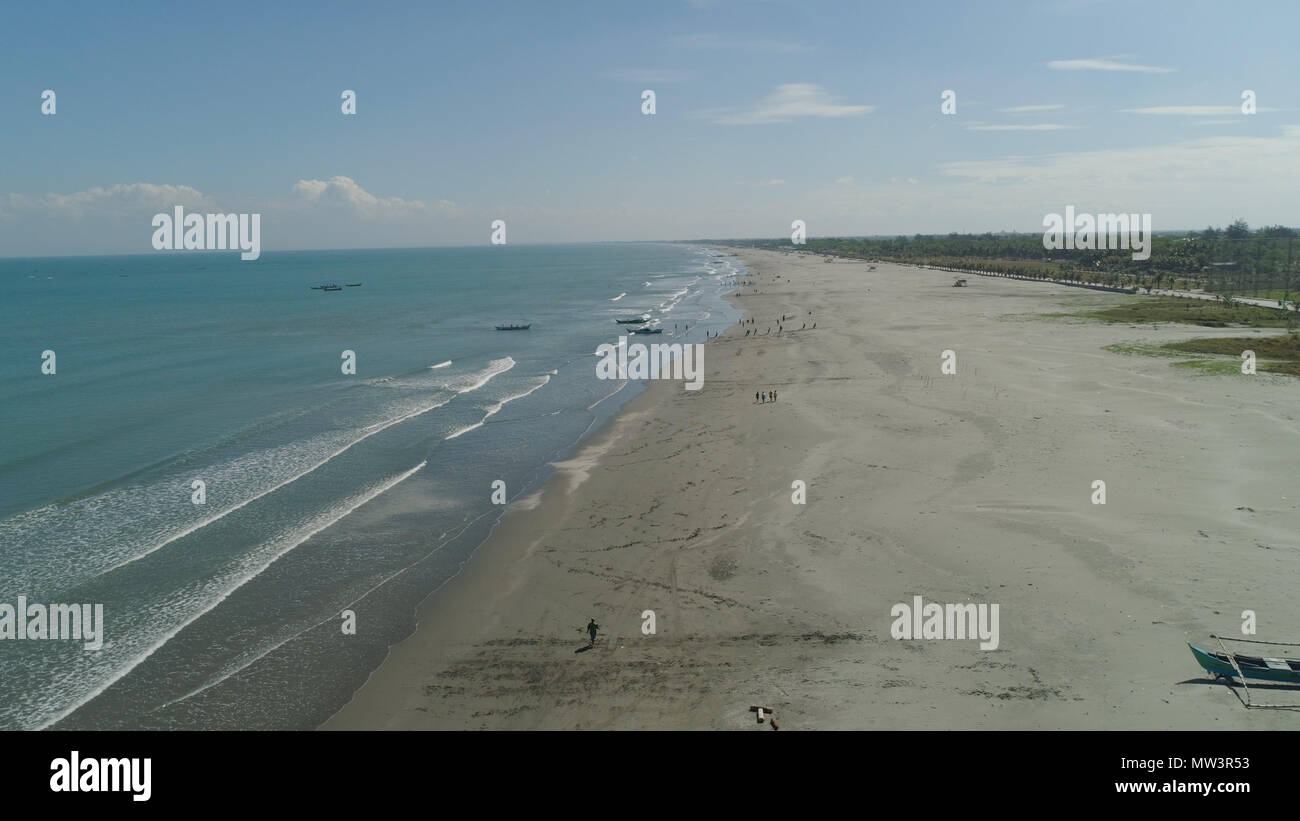 Aerial view of sandy beach Lingayen with fishermen using nets for ...