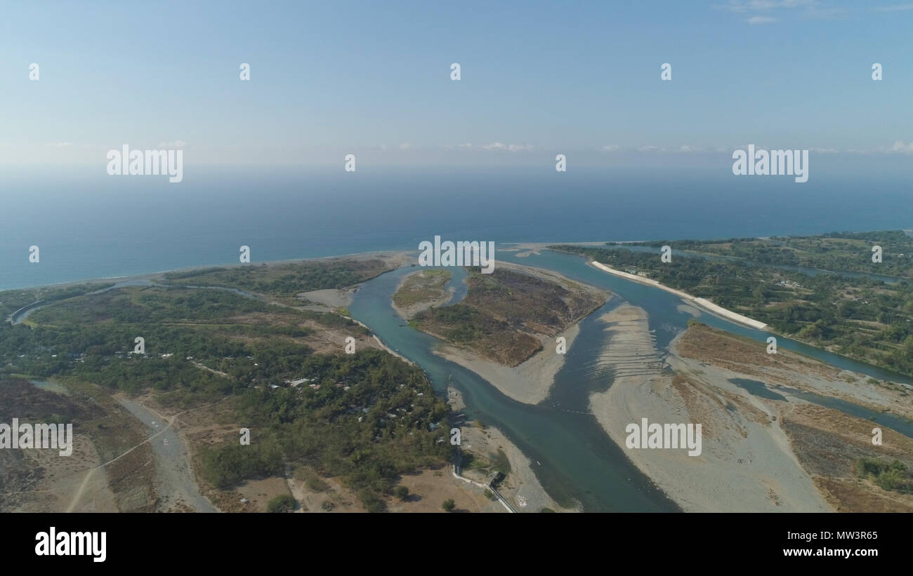 Aerial view of rver flowing into the sea in Philippines,Luzon. ropical ...