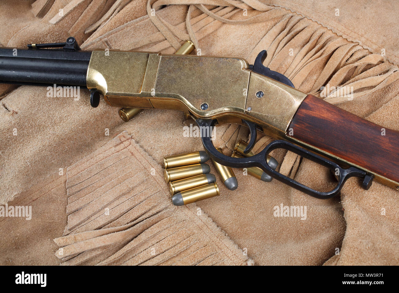 Wild west period repeating rifle with ammunition and sheriff badge ...