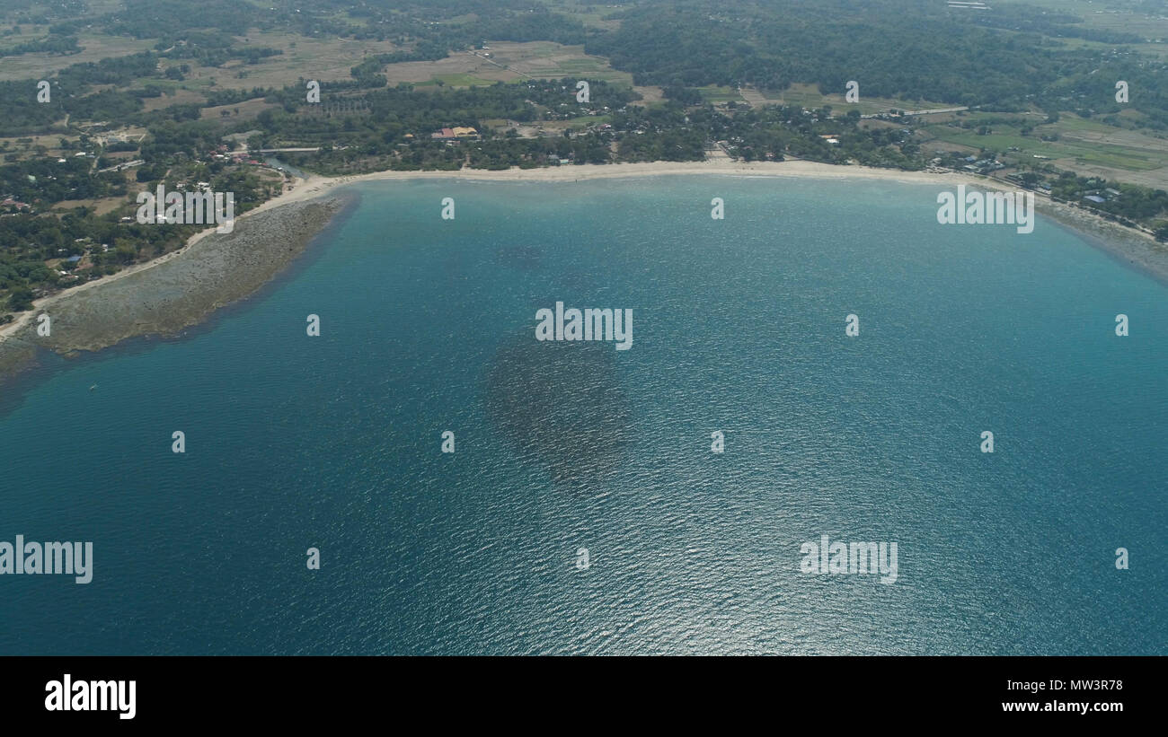 Beautiful tropical beach Cabugao with white sand and palm trees in the ...