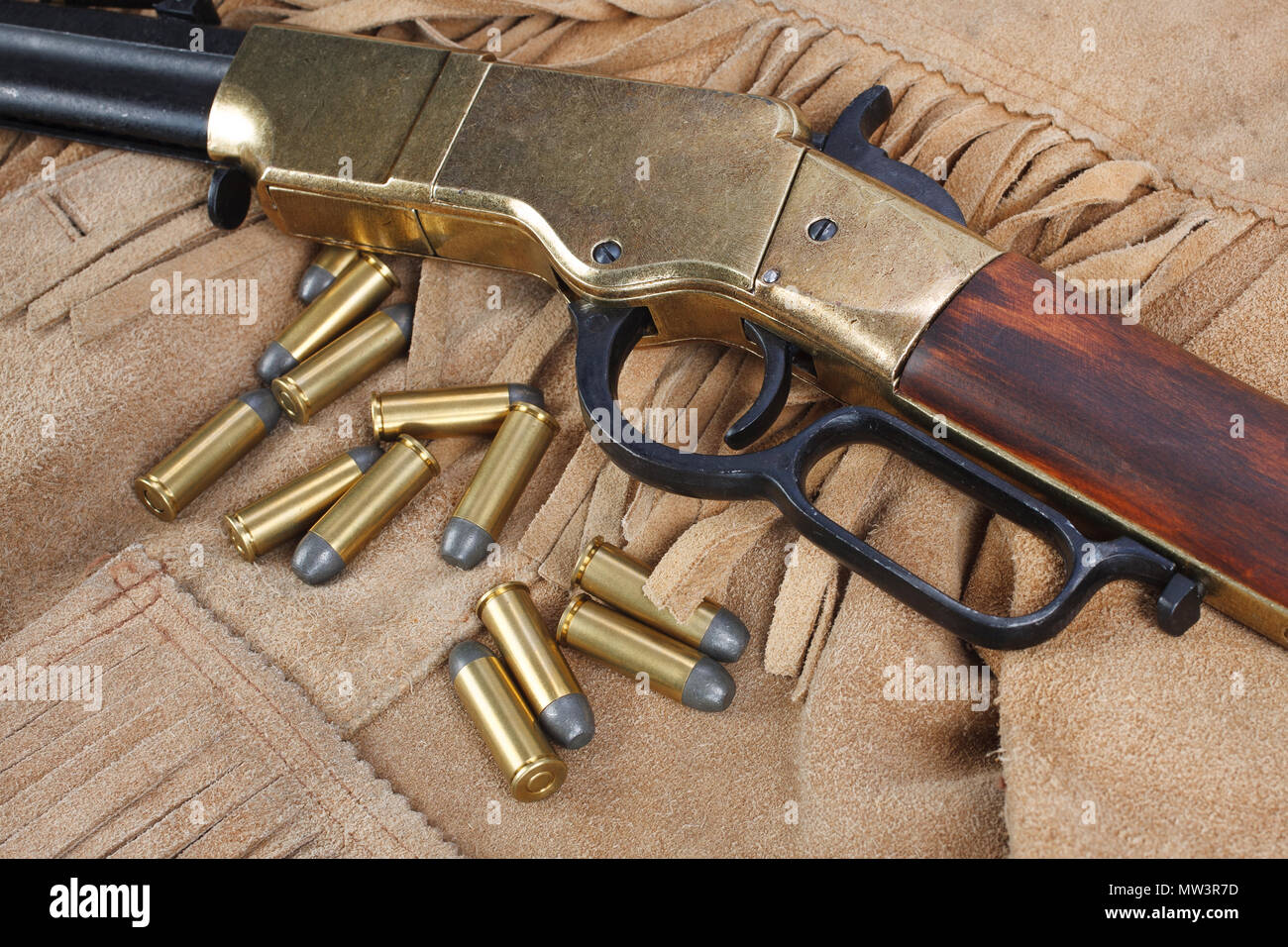 Wild west period repeating rifle with ammunition and sheriff badge ...