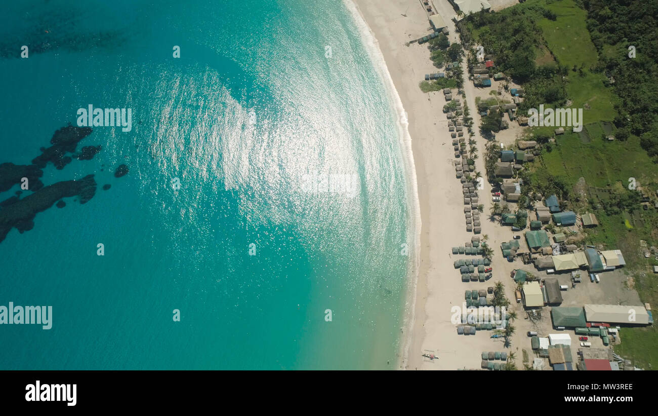 Aerial view of beautiful tropical beach with turquoise water in blue ...