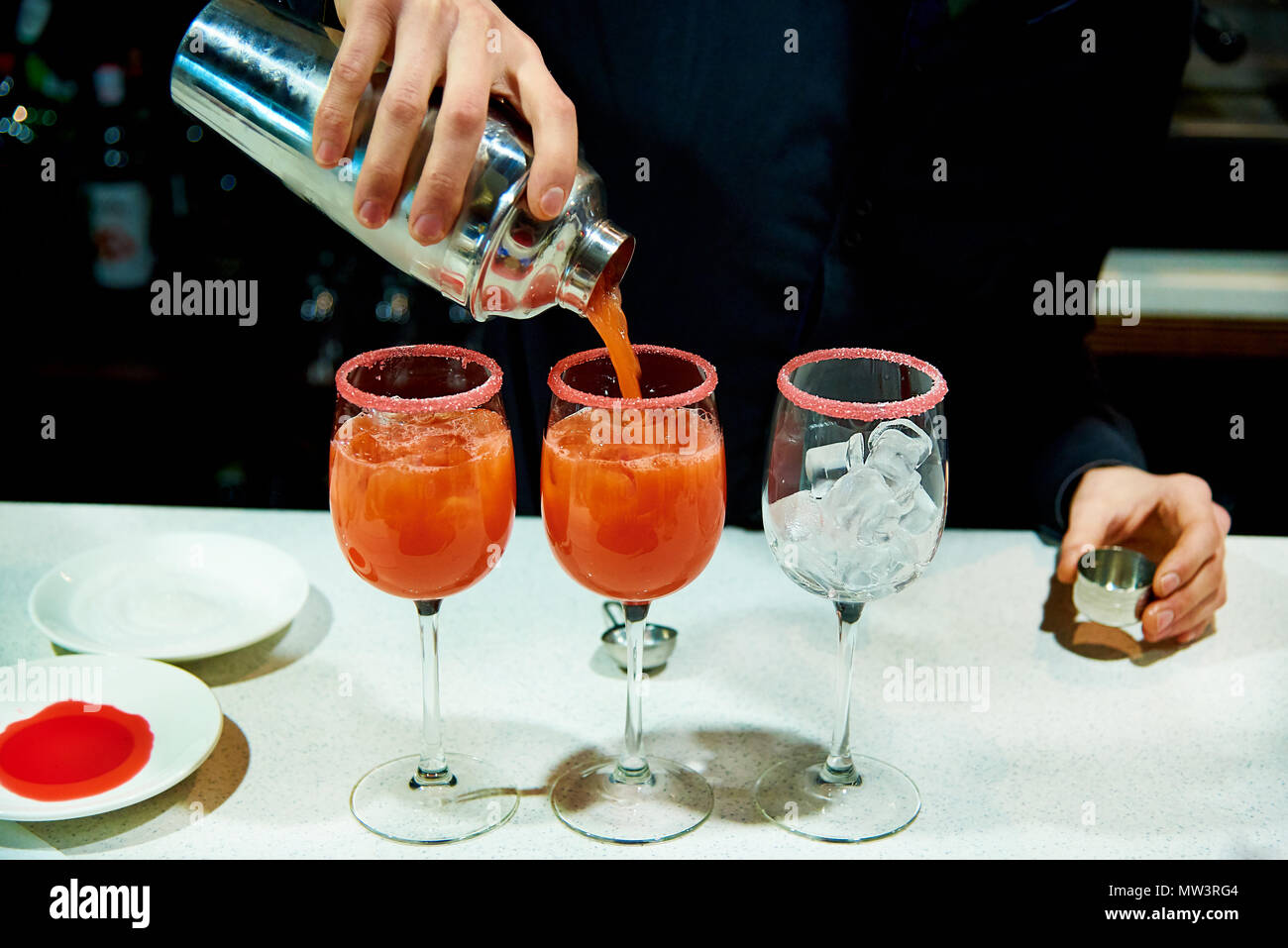 Man pouring drink from shaker hi-res stock photography and images - Alamy