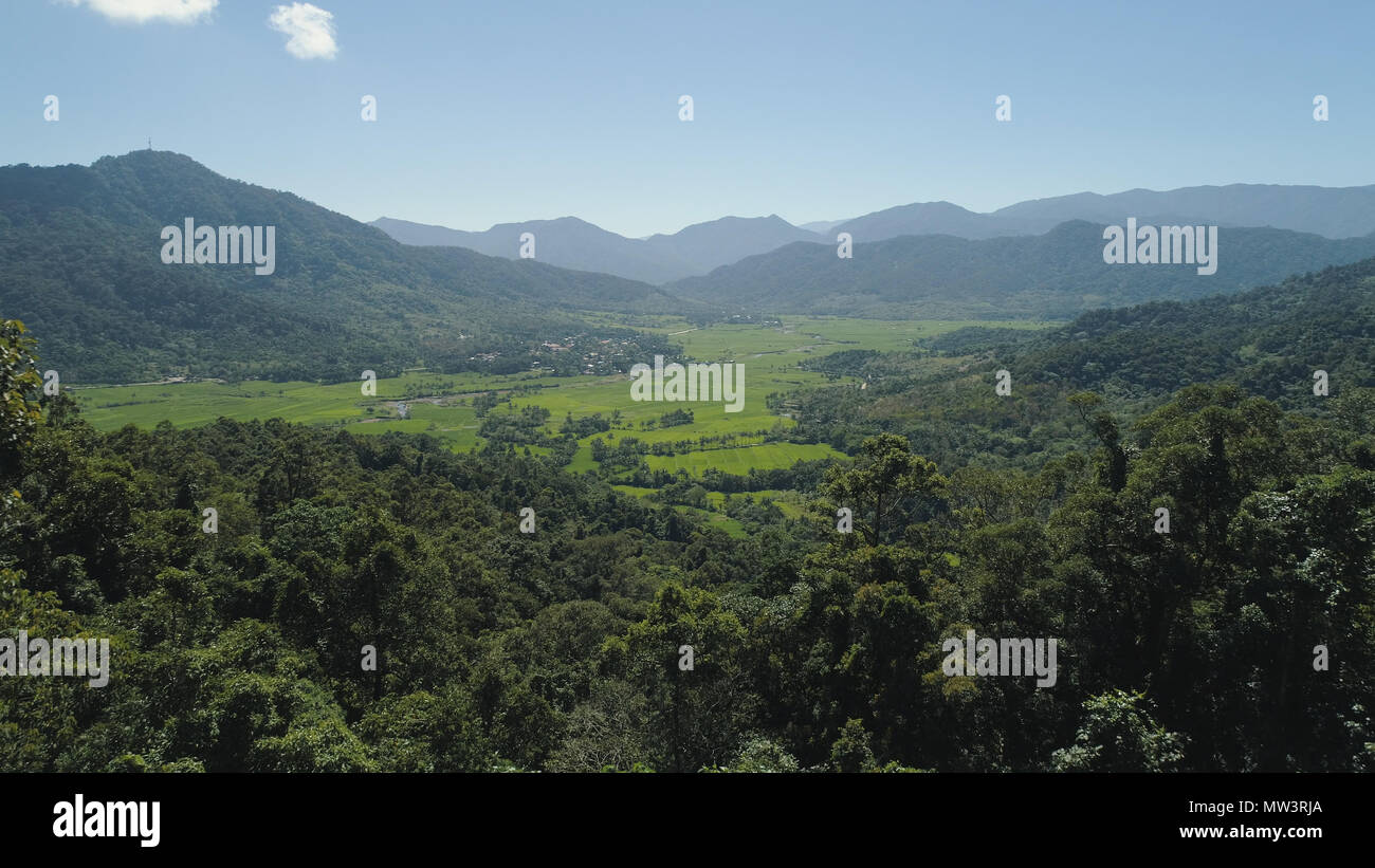 Mountain valley with village, farmland, rice fields. Aerial view of ...