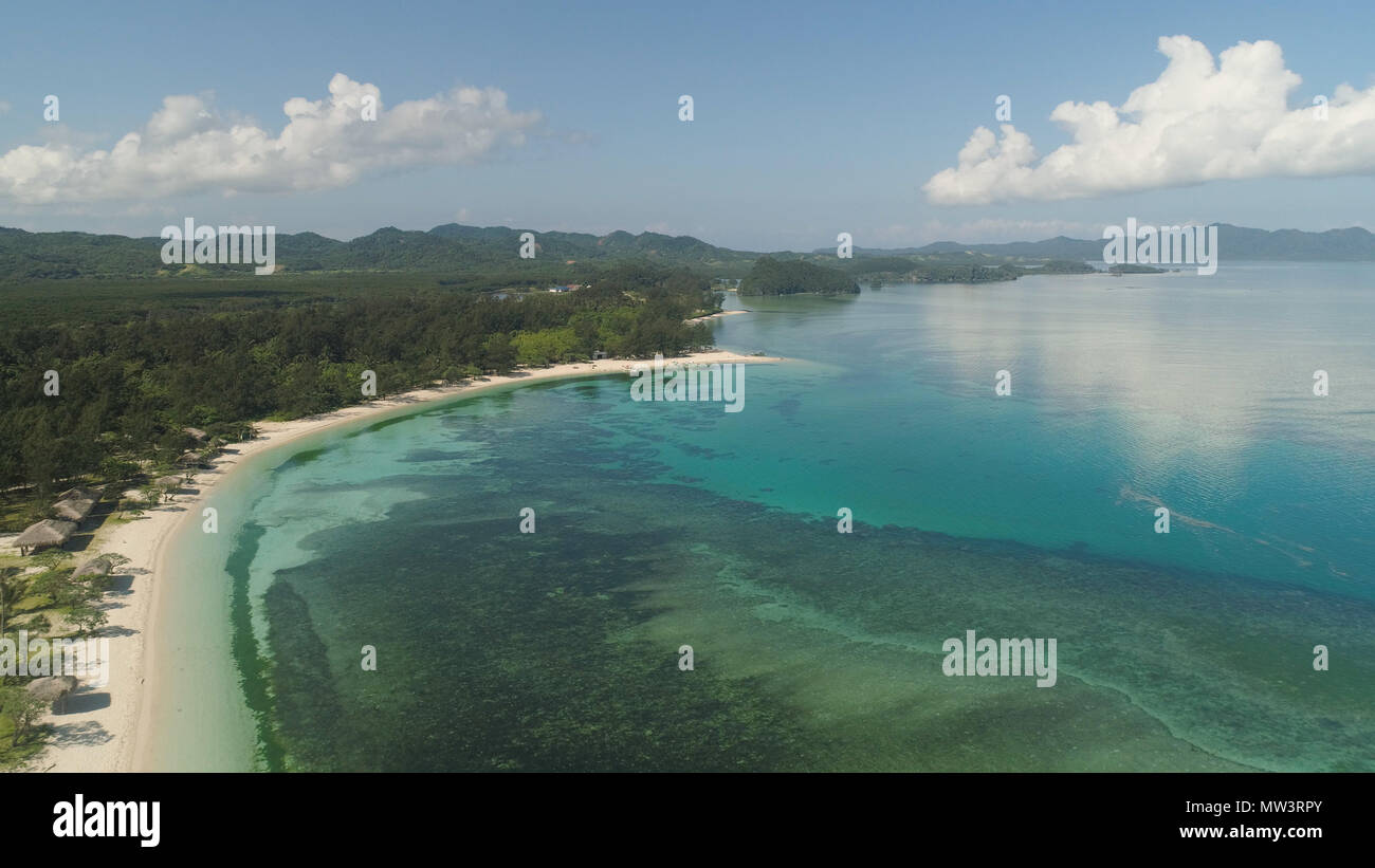 Aerial view of beautiful tropical beach with turquoise water in blue ...