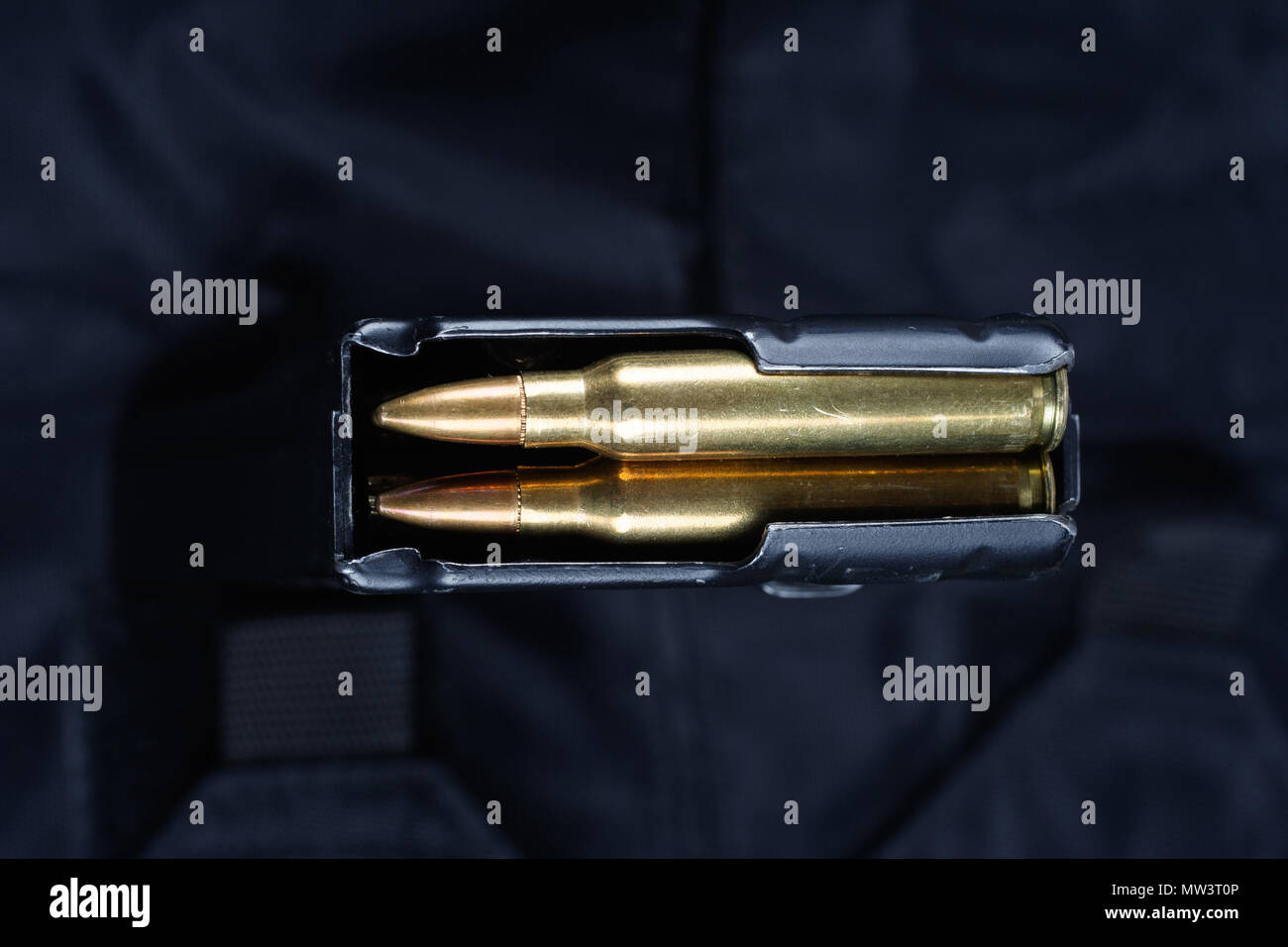 M16 rifle magazine with cartridges on black uniform Stock Photo - Alamy