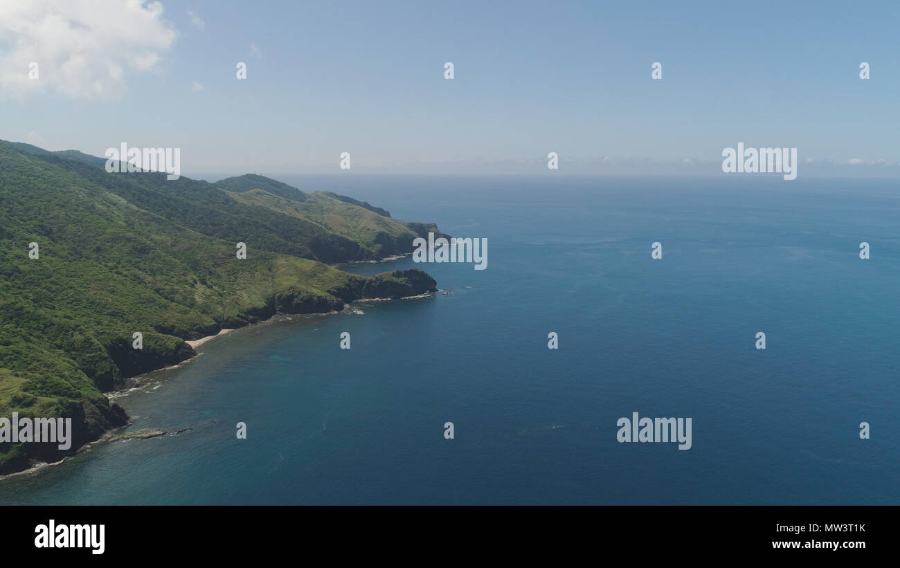 Coast of a tropical island Palau with mountains covered with rainforest ...