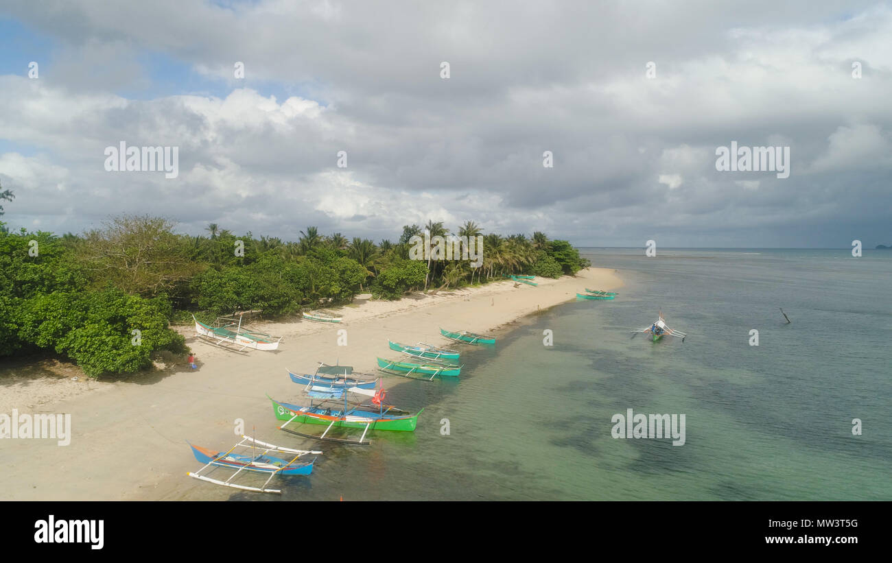 Aerial view of beautiful tropical beach with turquoise water in blue ...