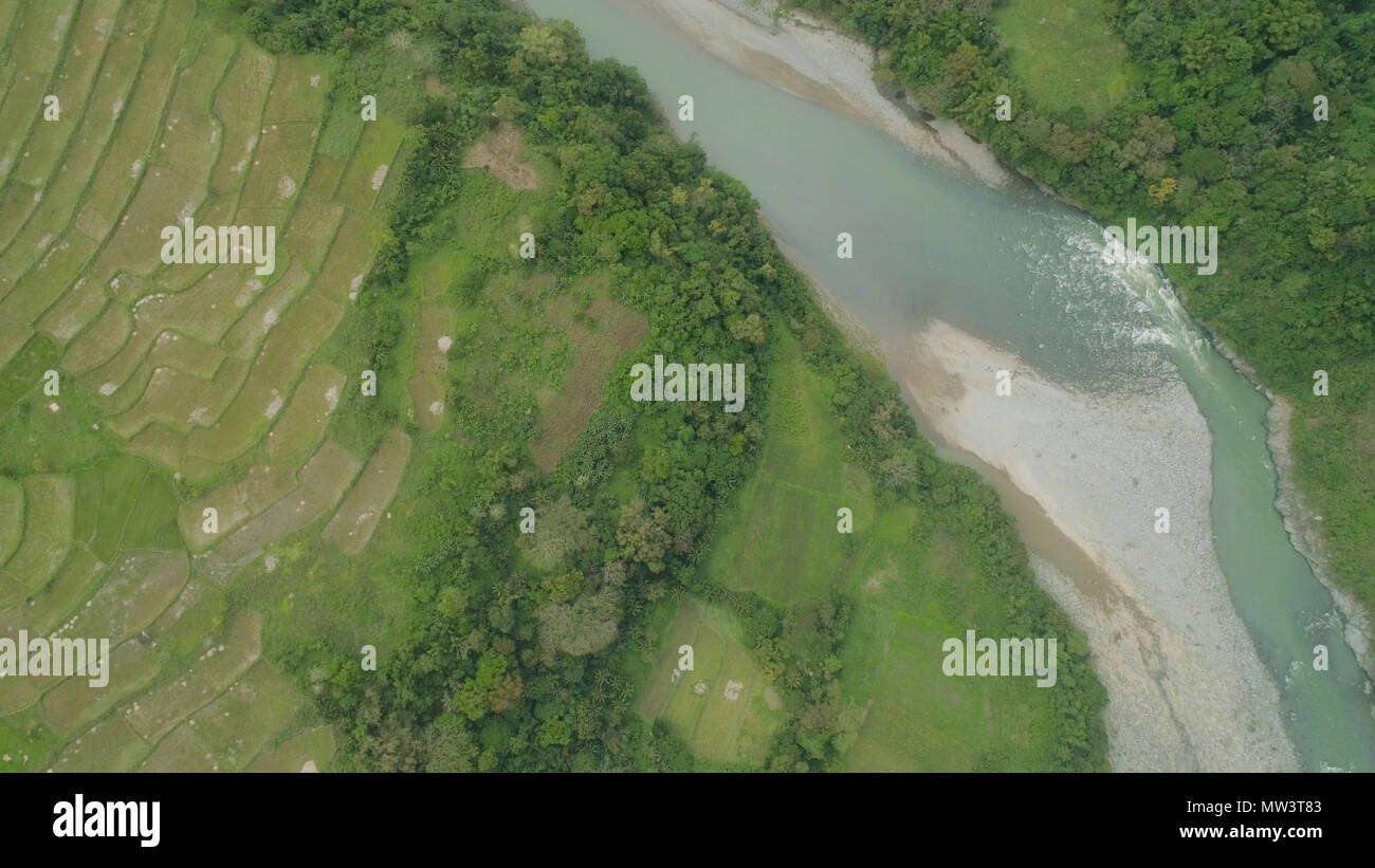 Aerial view of mountain valley in the cordillera, river, rice terraces ...