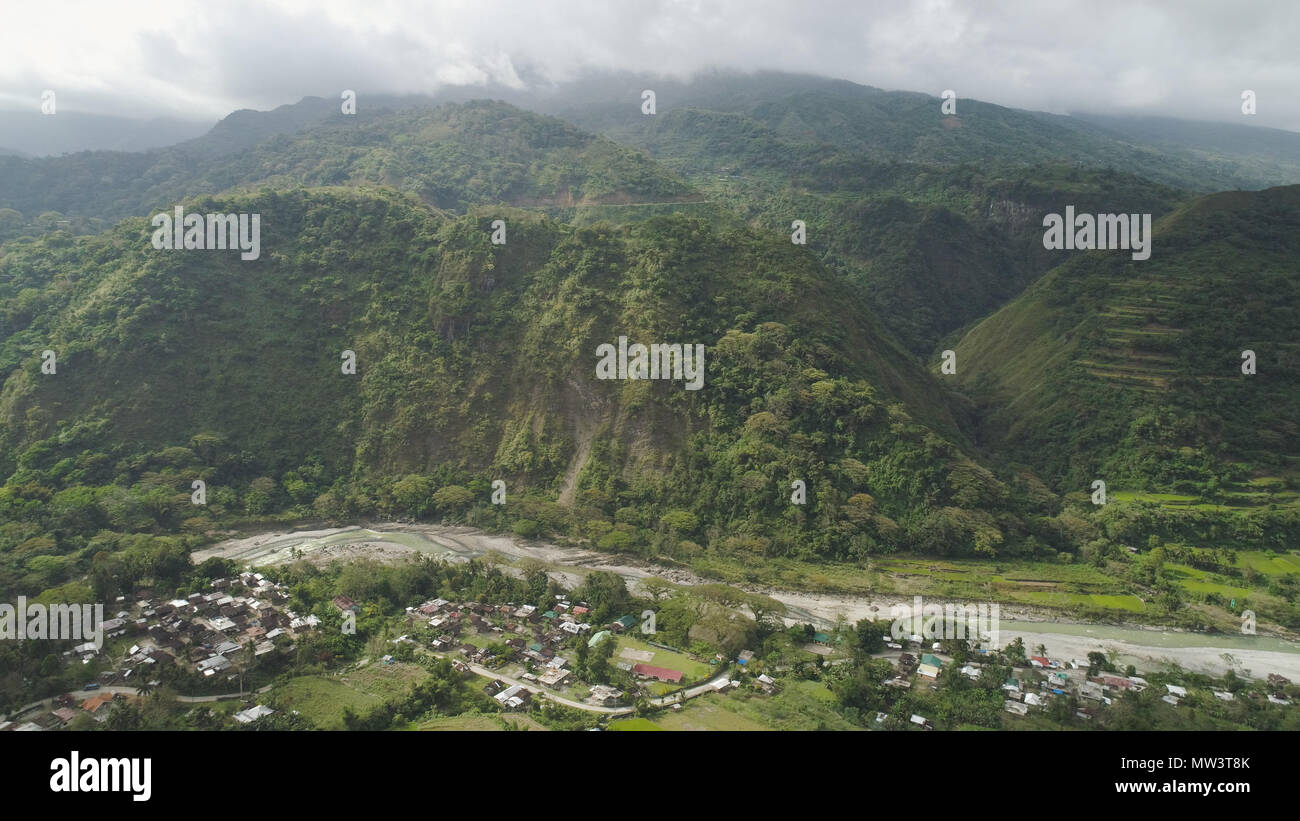 Aerial view of mountain valley with river, rice terraces, farmland in ...