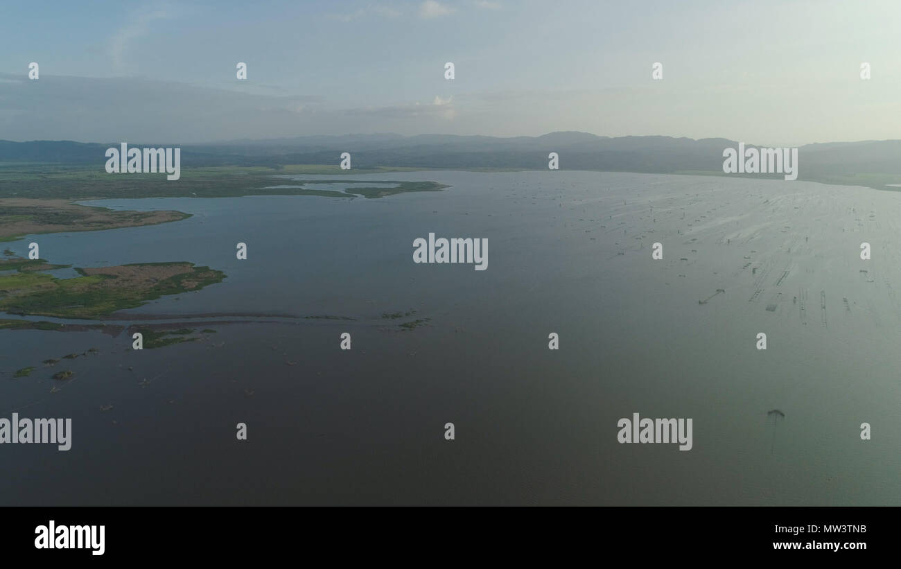 Aerial view of agricultural land, rice terraces near the lake Bato ...