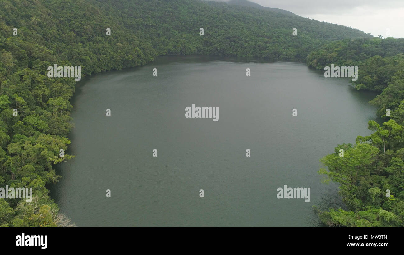 Aerial view of lake Bulusan in the mountains with green rain forest ...
