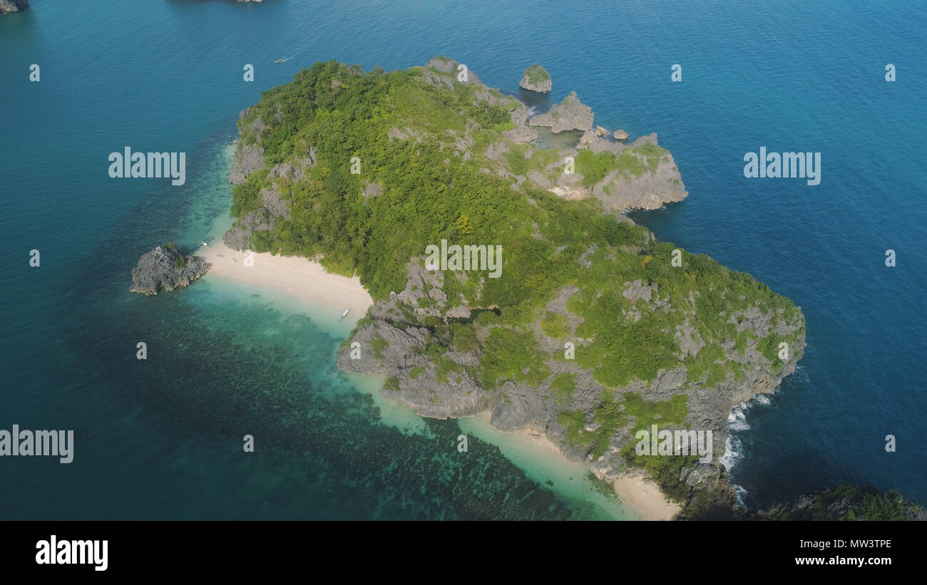 Aerial view island with sand beach and turquoise water in blue lagoon ...
