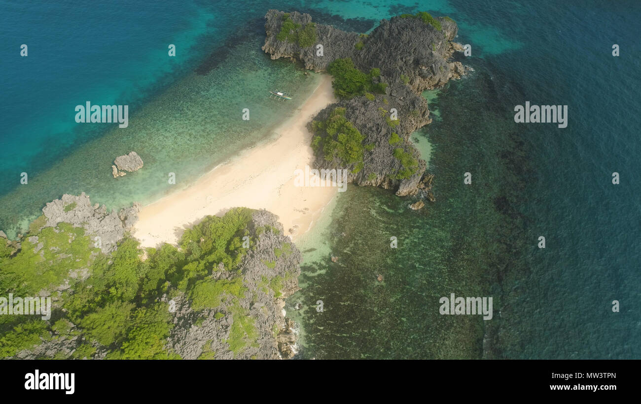 Aerial view island with sand beach and turquoise water in blue lagoon ...