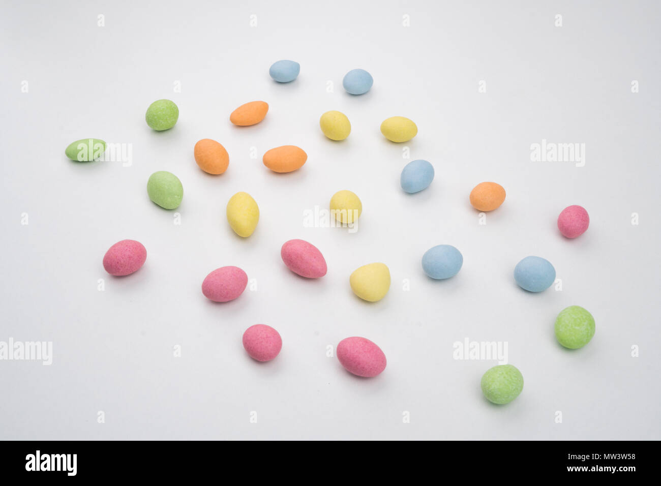 Colorful candy scattered on the table Stock Photo - Alamy