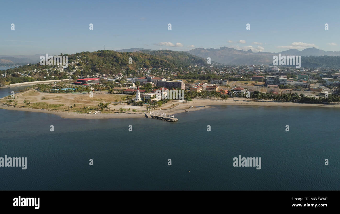 Coastline with beach and lighthouse, mountains. Aerial view: Coast sea ...
