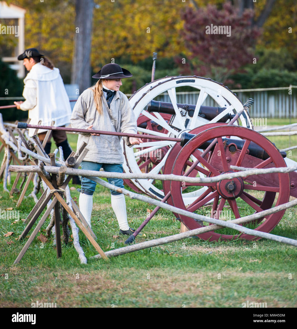 Two Colonials loading, cleaning and tending cannons on the parade ...