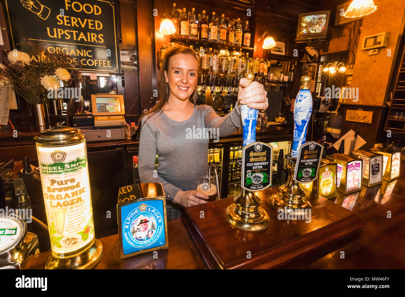 England, London, Southwark, Anchor Tap Pub, Barmaid Serving Beer Stock ...