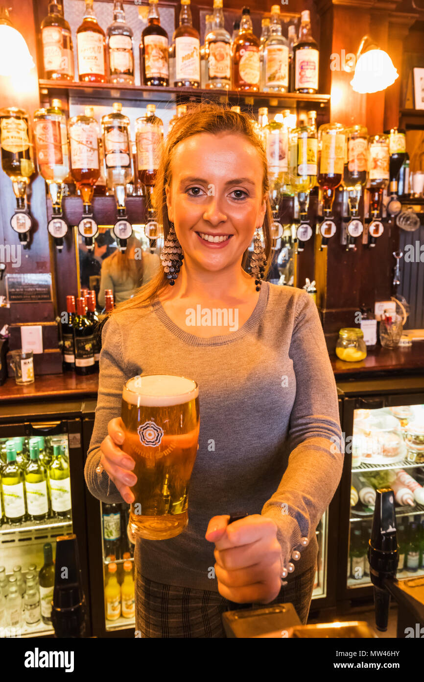 England, London, Southwark, Anchor Tap Pub, Barmaid Serving Beer Stock ...