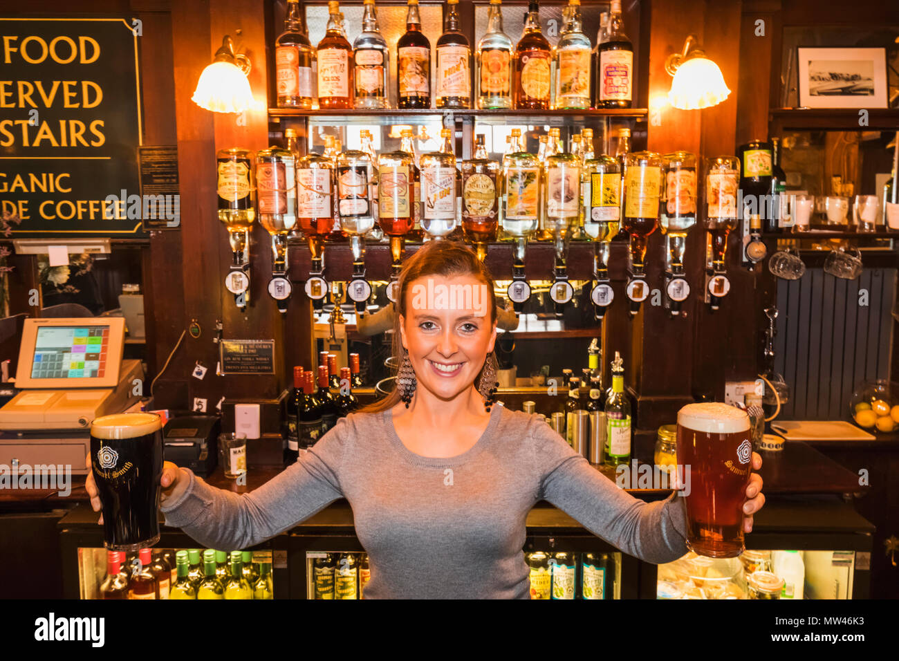 England, London, Southwark, Anchor Tap Pub, Barmaid Serving Beer Stock ...