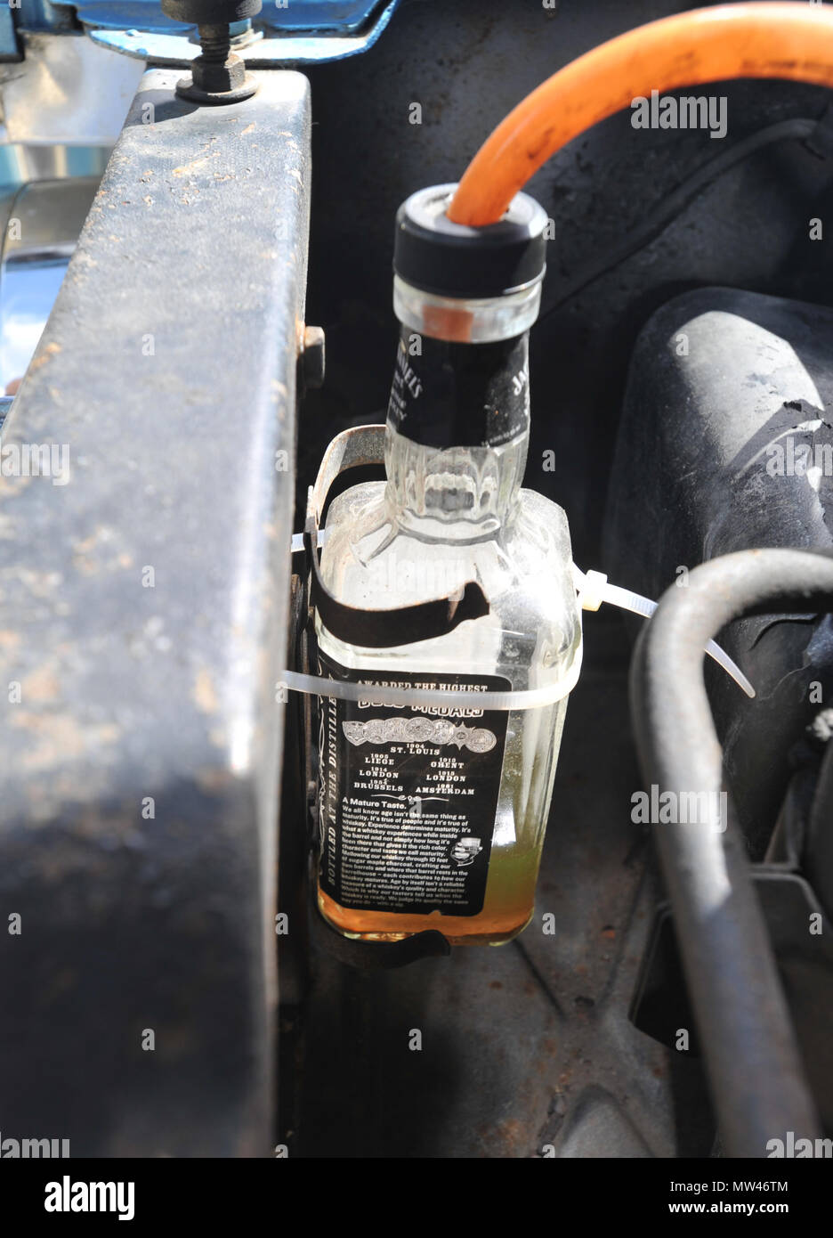 Whiskey bottle radiator expansion tank on a 1963 Oldsmobile Dynamic 88 ...