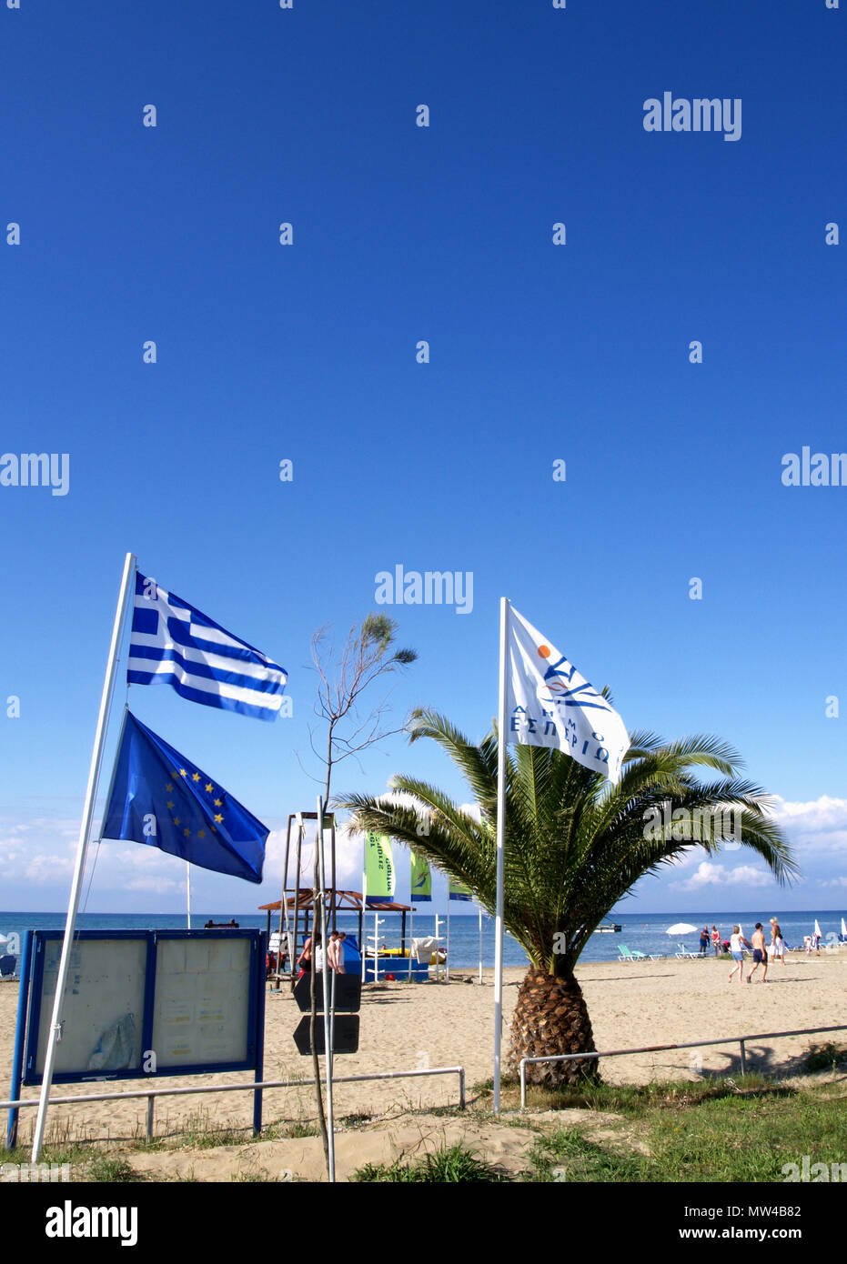 Flags flying at Sidari Beach, Corfu, Greece Stock Photo - Alamy