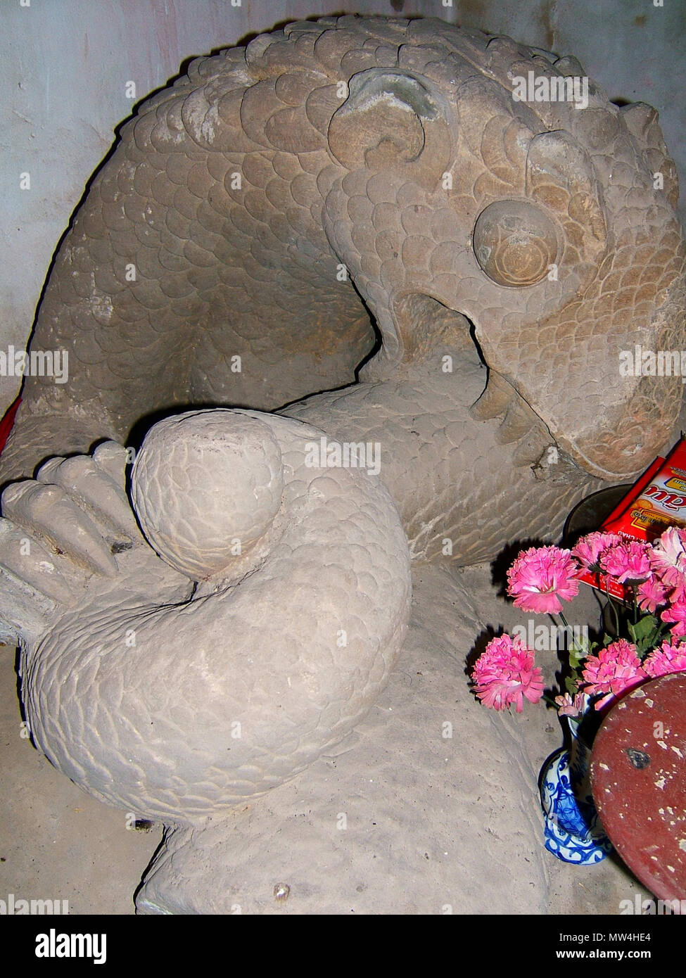 . English: The statue of the snake eating his own tail at the field ...