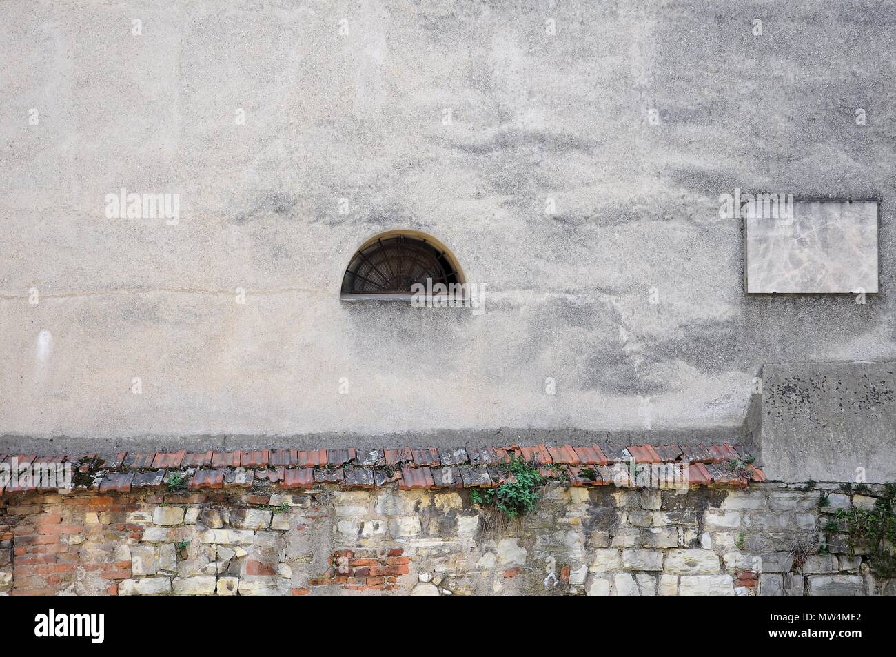 Medieval wall with small window. Useful for texture or background Stock ...
