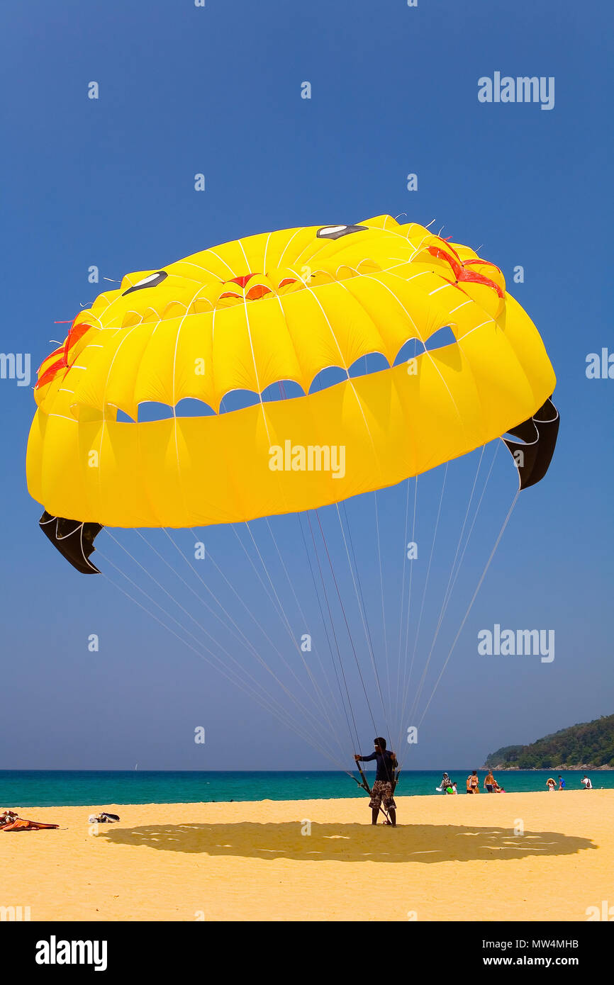 Karon, Thailand, February 16, 2018: A paratrooper under a yellow dome ...