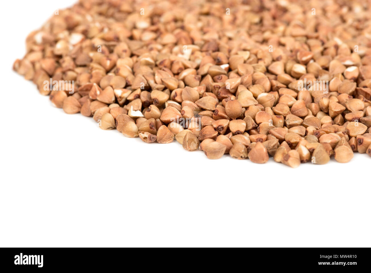 Scattered grains of dry buckwheat on a white background Stock Photo - Alamy