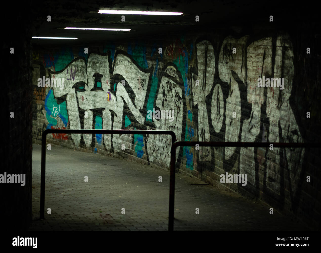 Dark tunnel with graffiti Stock Photo - Alamy