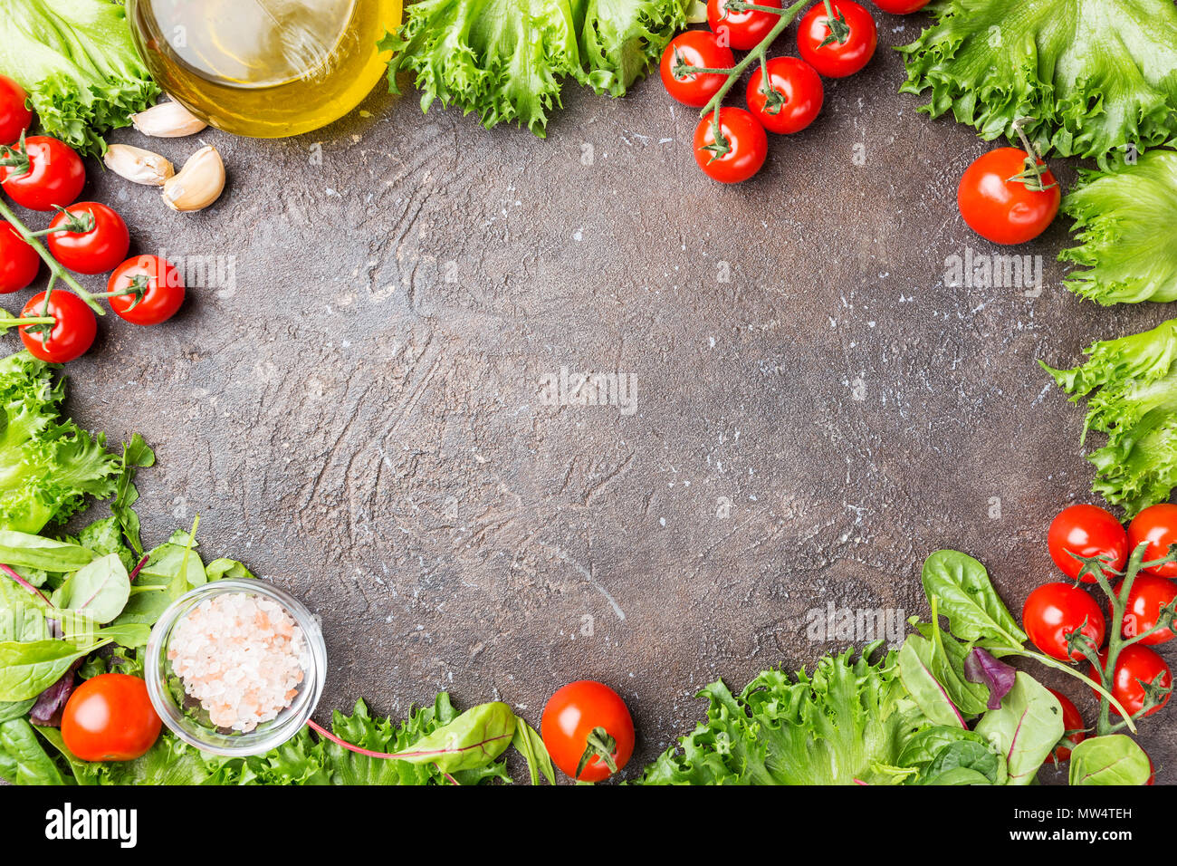 Green salad frame on dark stobe background, top view with copy space ...